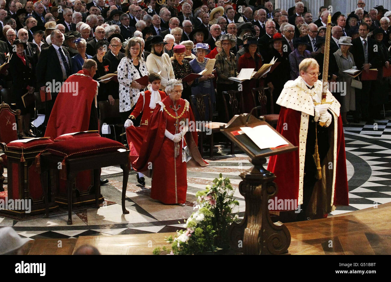 The Lord Mayor of London, David Wootton (right) carries the pearl sword ...