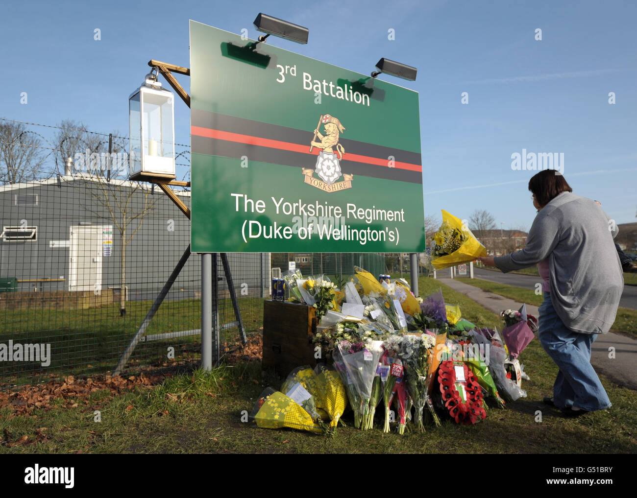 A person lays a floral tribute at the 3rd Battalion The Yorkshire ...