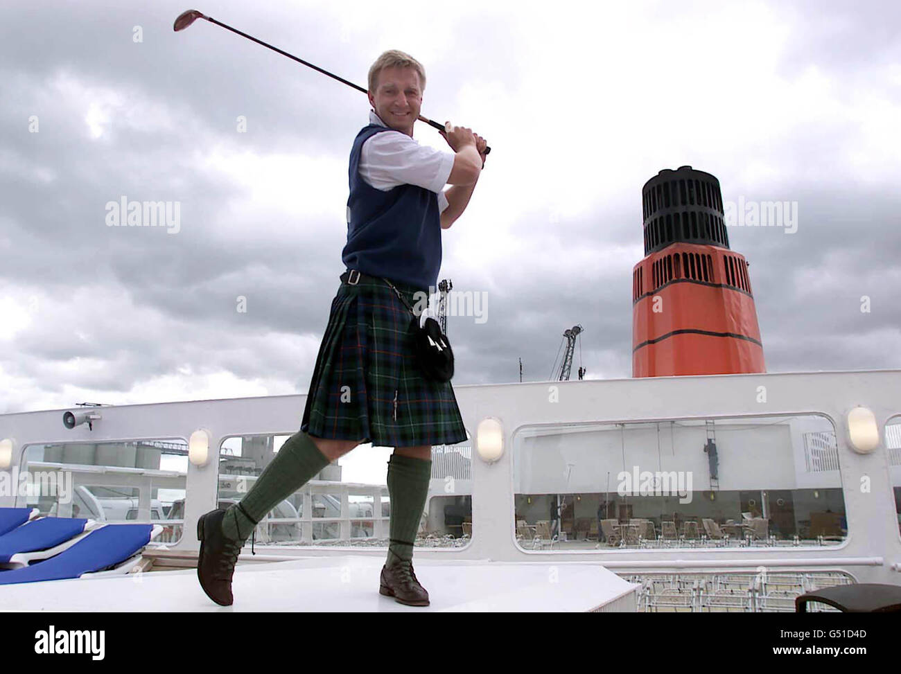 Colin Braid tees off from the sun deck of Cunard's flagship the QE2 in ...