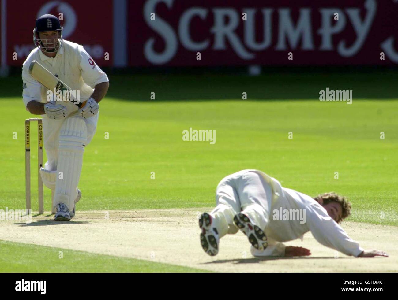 Zimbabwe's Guy Whitall (R) tries to catch a shot from Graeme Hick ...