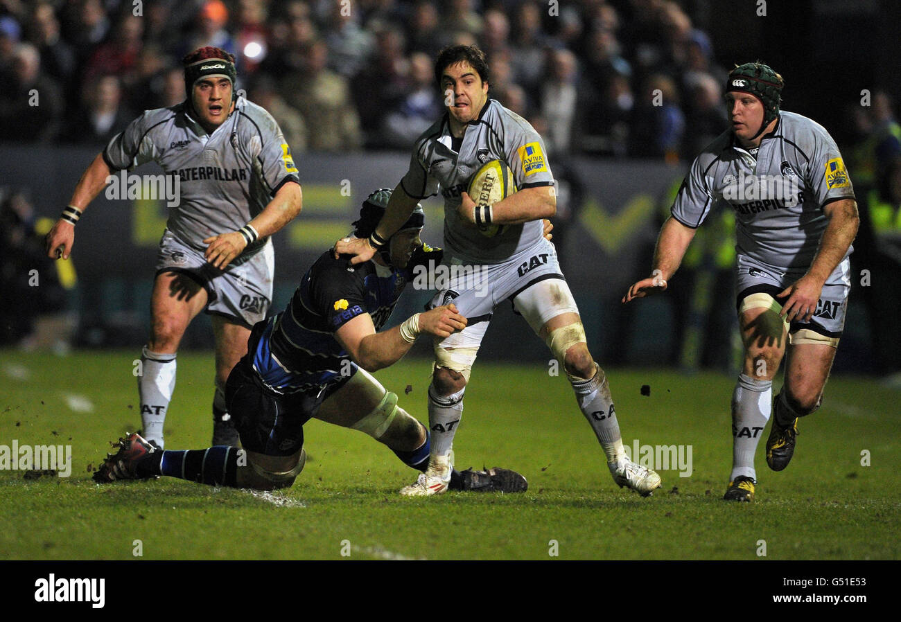 Leicester's Horacio Agulla powers through the tackle of Bath's Dave ...