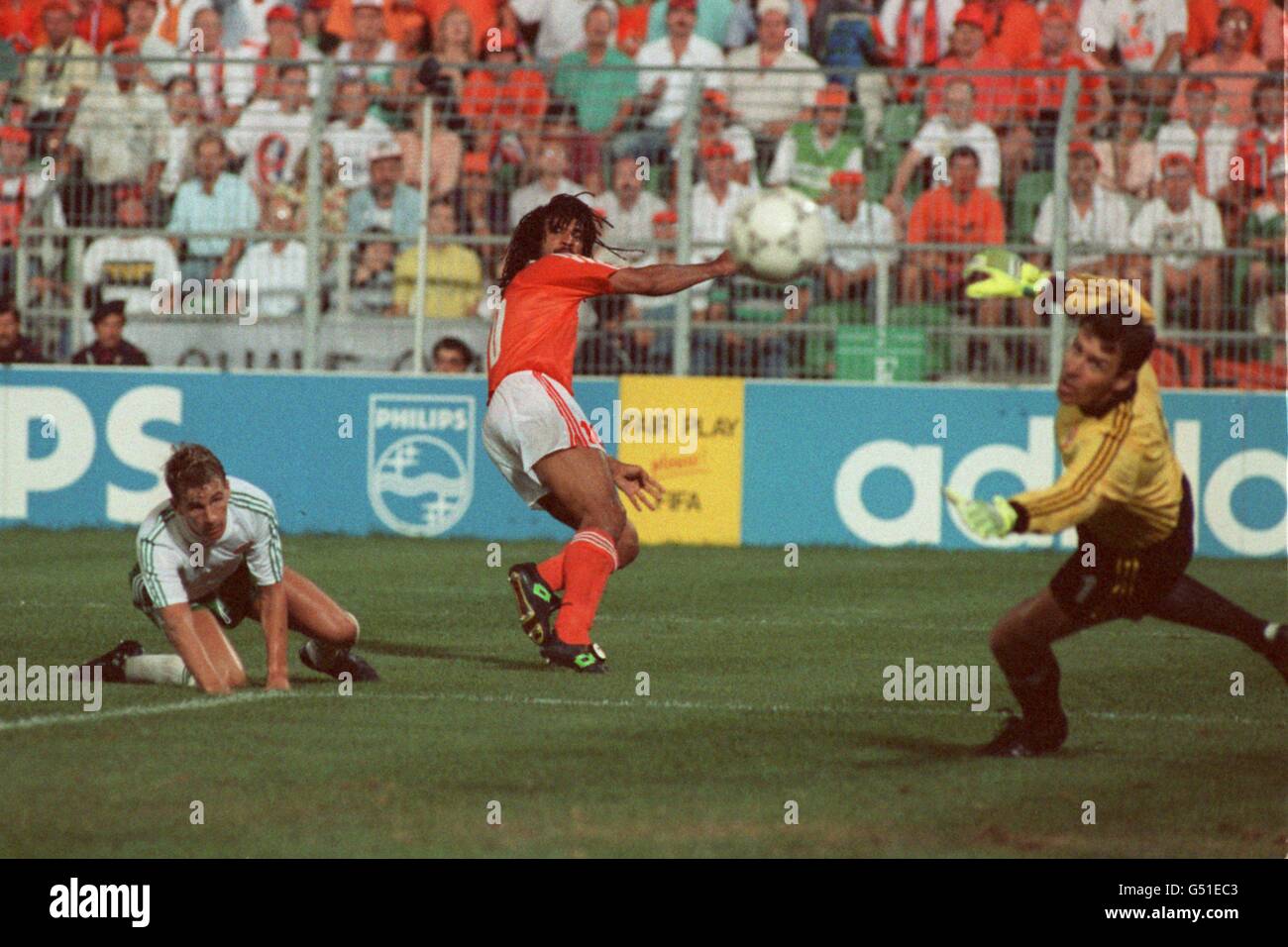 Holland's Ruud Gullit (centre) fires a shot goalwards as Ireland's Pat ...
