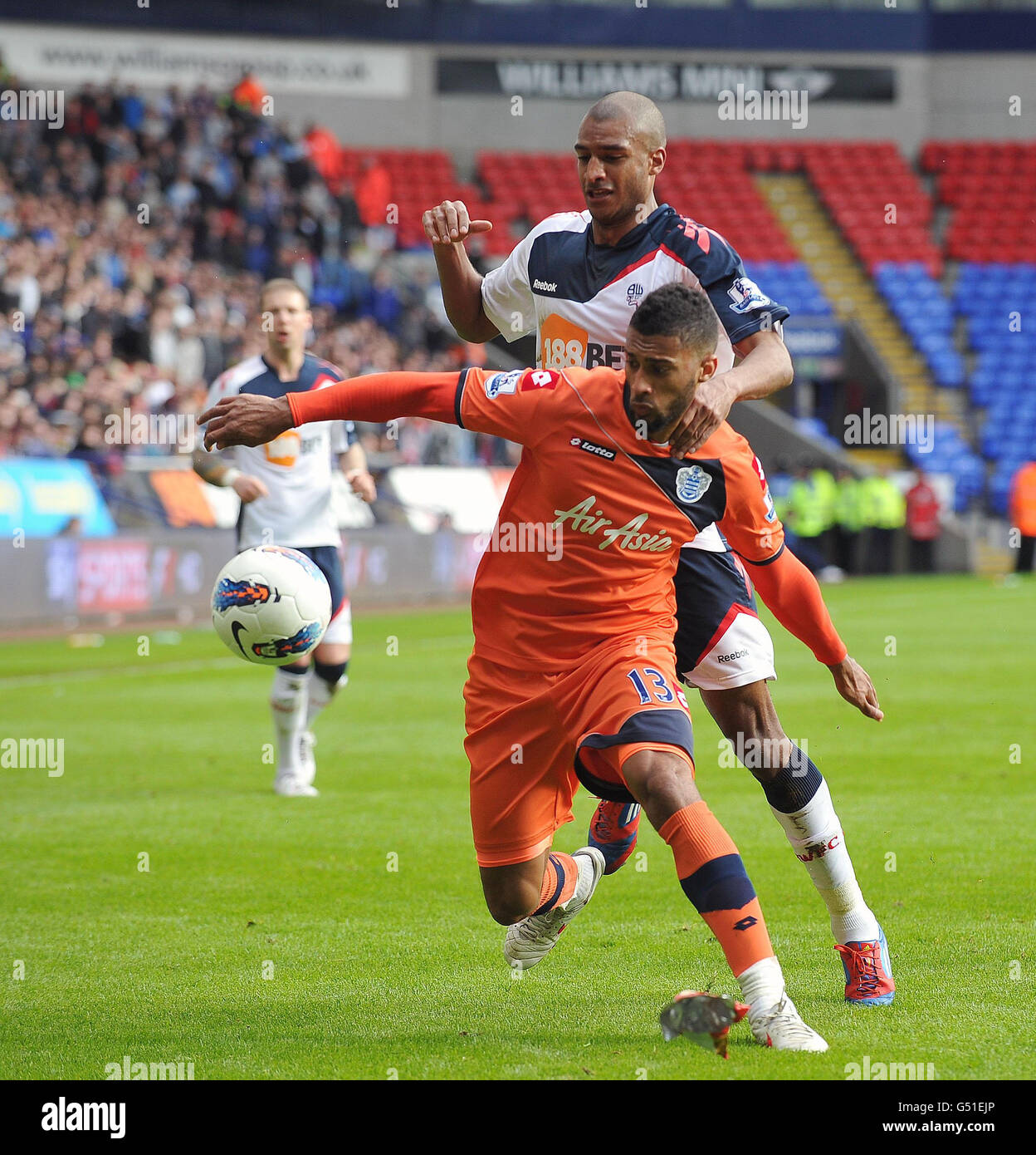 Bolton's David Ngog (top) and QPR's Armand Traore in action during the ...