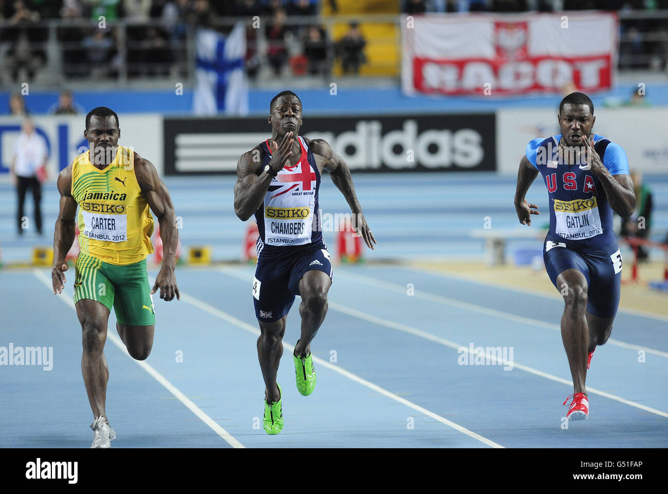 Great Britain's Dwain Chambers (centre) finishes in third place behind ...