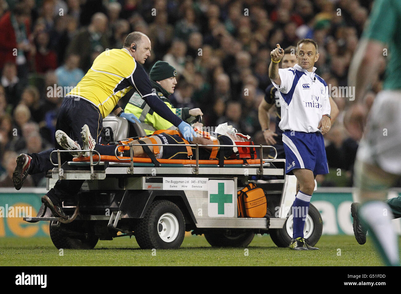 Scotland's Lee Jones being carried off injured during the RBS 6 Nations ...
