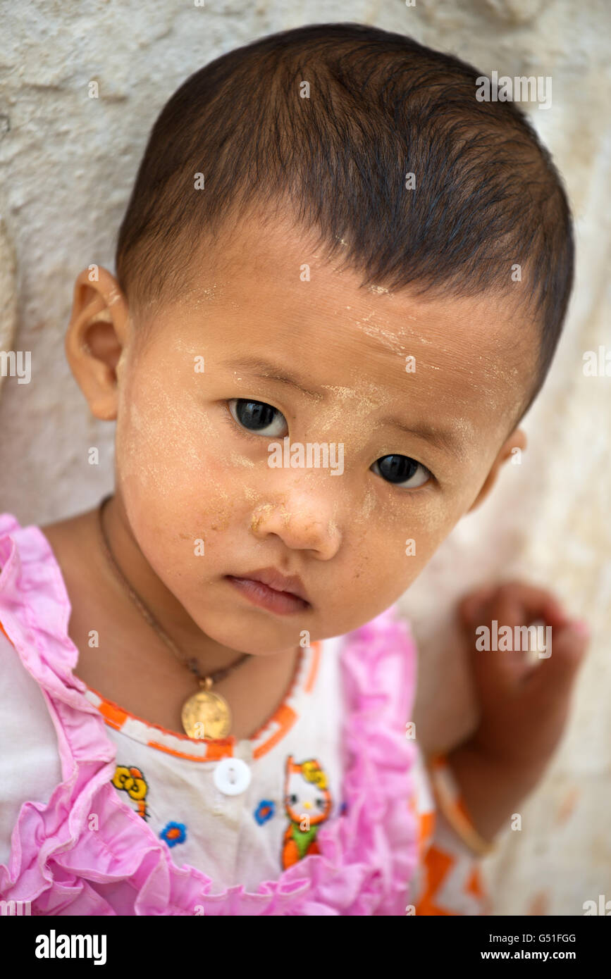 Young girl with thanaka paste on her face, Hsinbyume Pagoda, Mingun ...