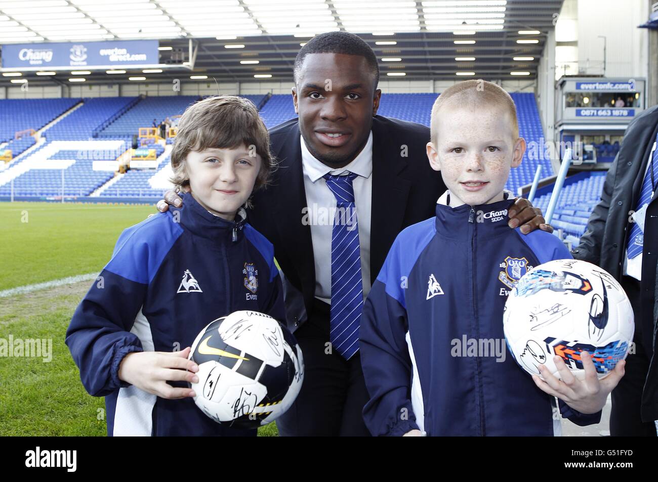 Everton's Victor Anichebe poses for photographs with matchday mascots ...