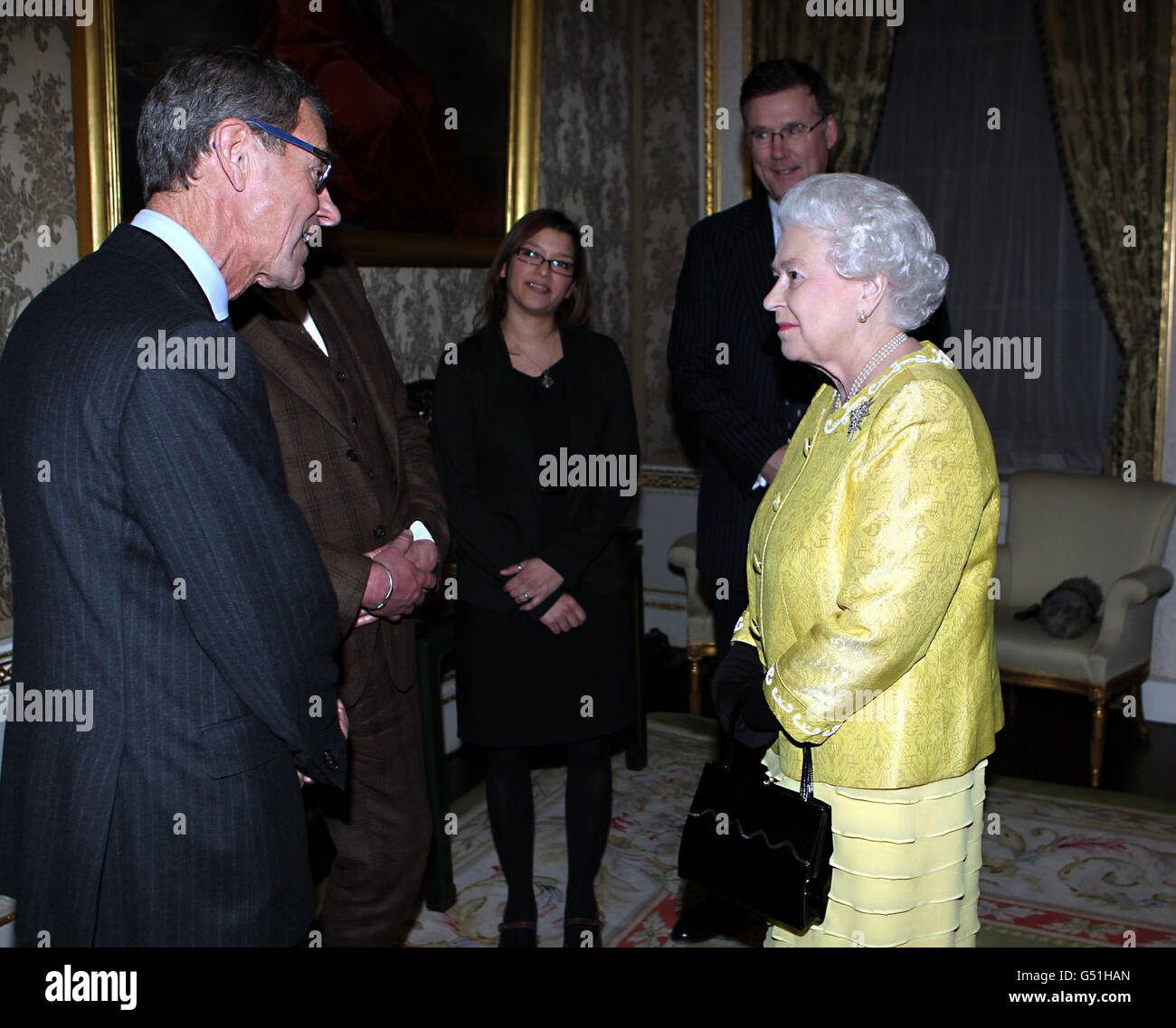 Queen Elizabeth II speaks with Mike Lockett during a Commonwealth ...