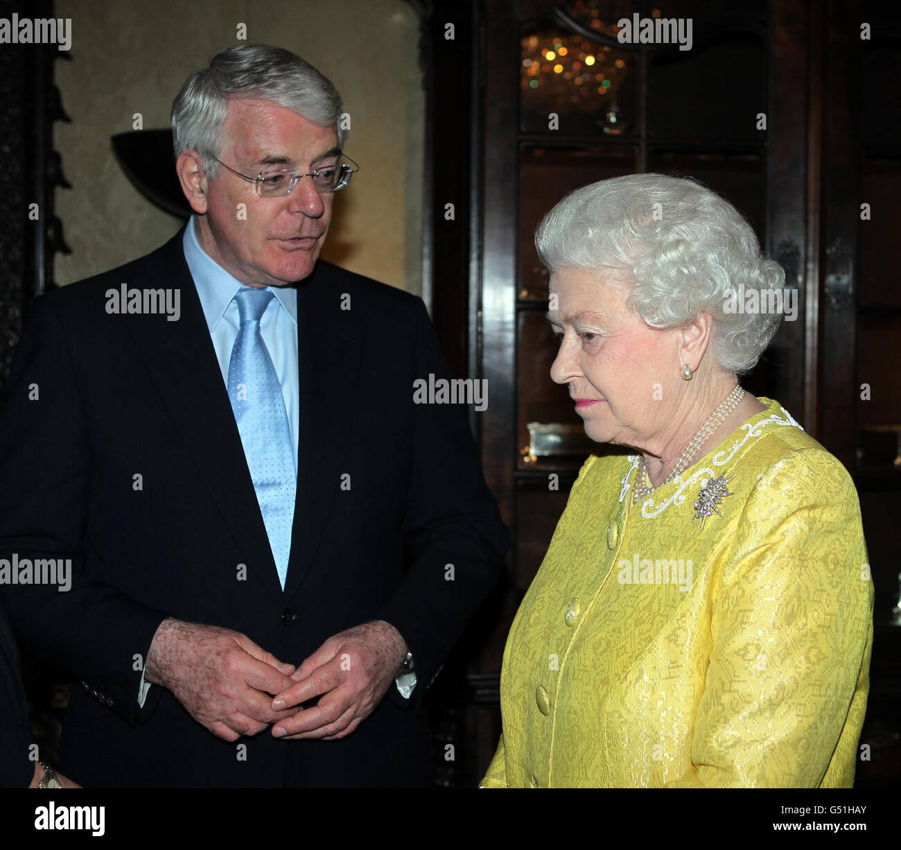 Queen Elizabeth II speaks with former Prime Minister John Major during ...