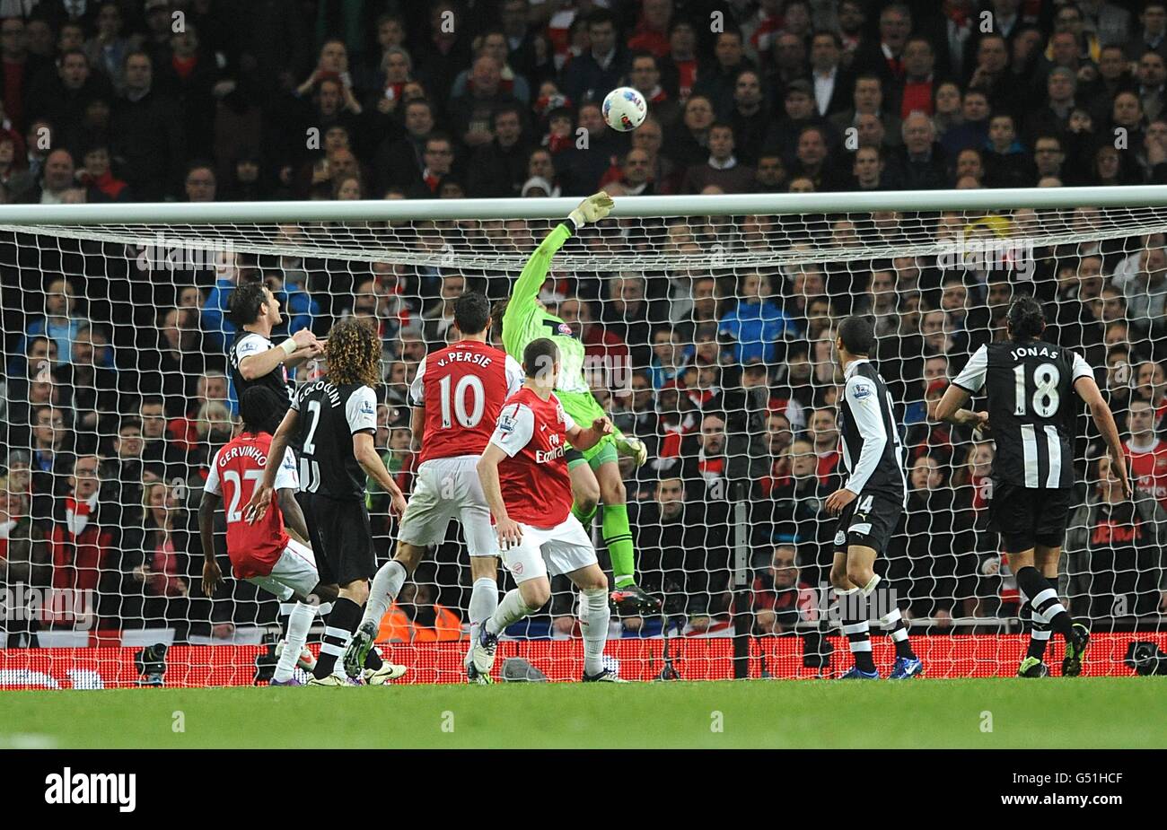 Newcastle United goalkeeper Tim Krul (centre) makes a save after a shot ...