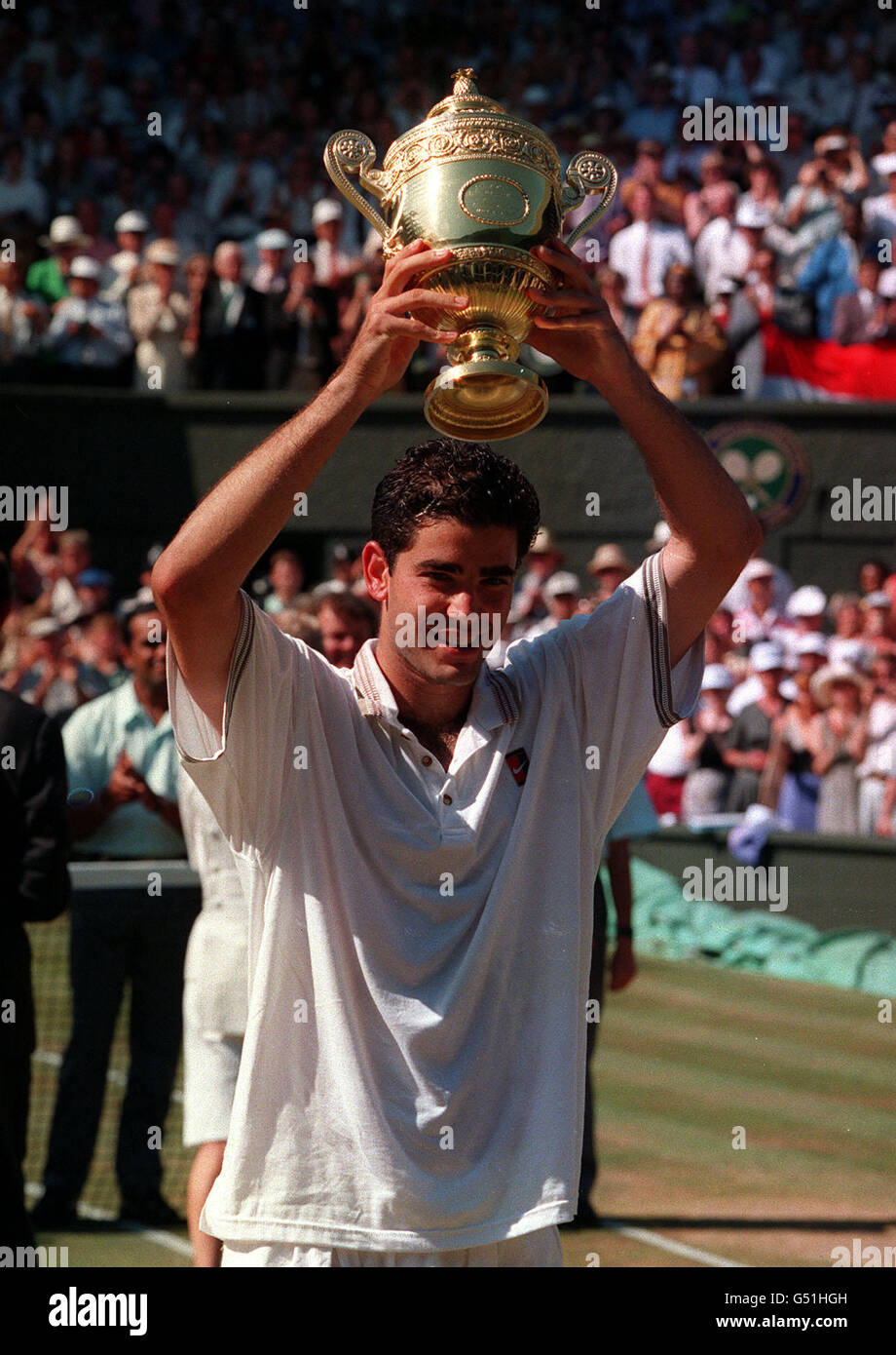 Pete Sampras holds aloft the men's singles trophy after retaining his ...