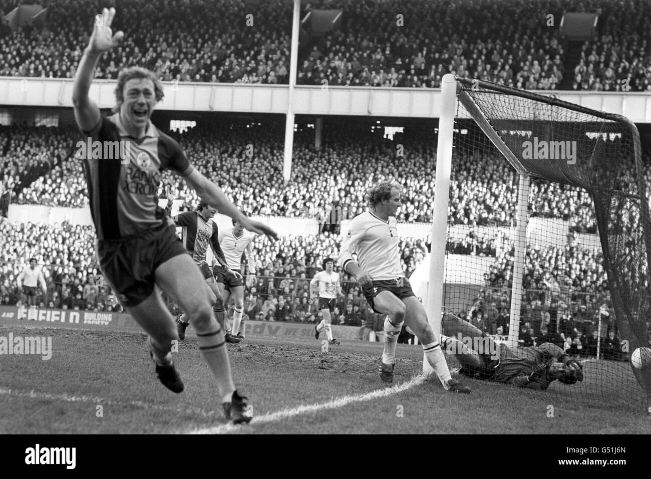 Charlie George (l) celebrates after seeing his shot evade Tottenham ...
