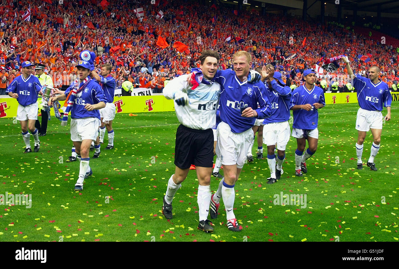 Rangers' Jorg Albertz and goalkeeper Stephan Klos, centre, lead the ...