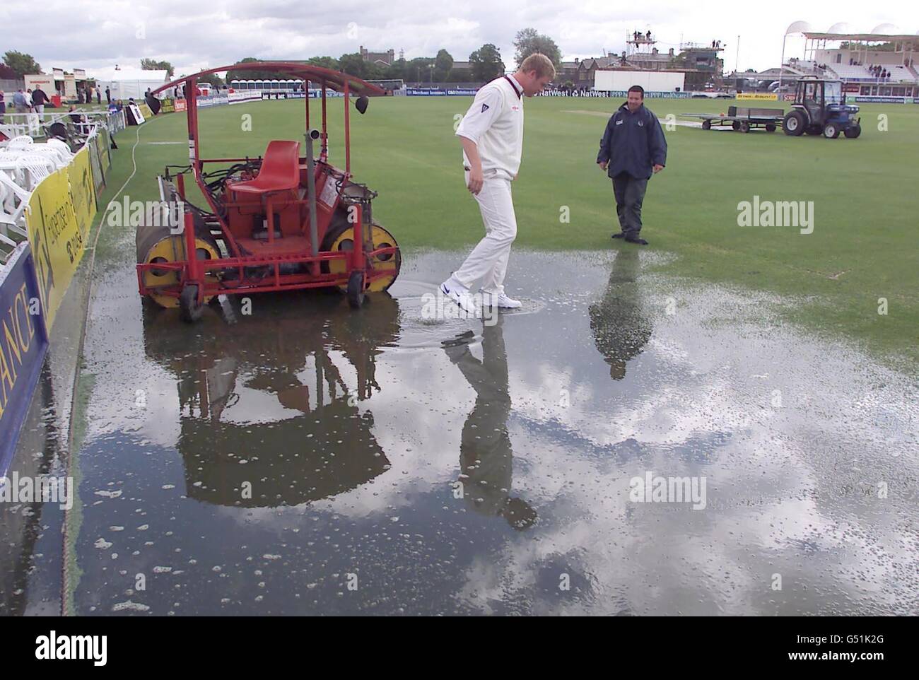 Lancashire's Andrew Flintoff supervises the mopping up operation at ...