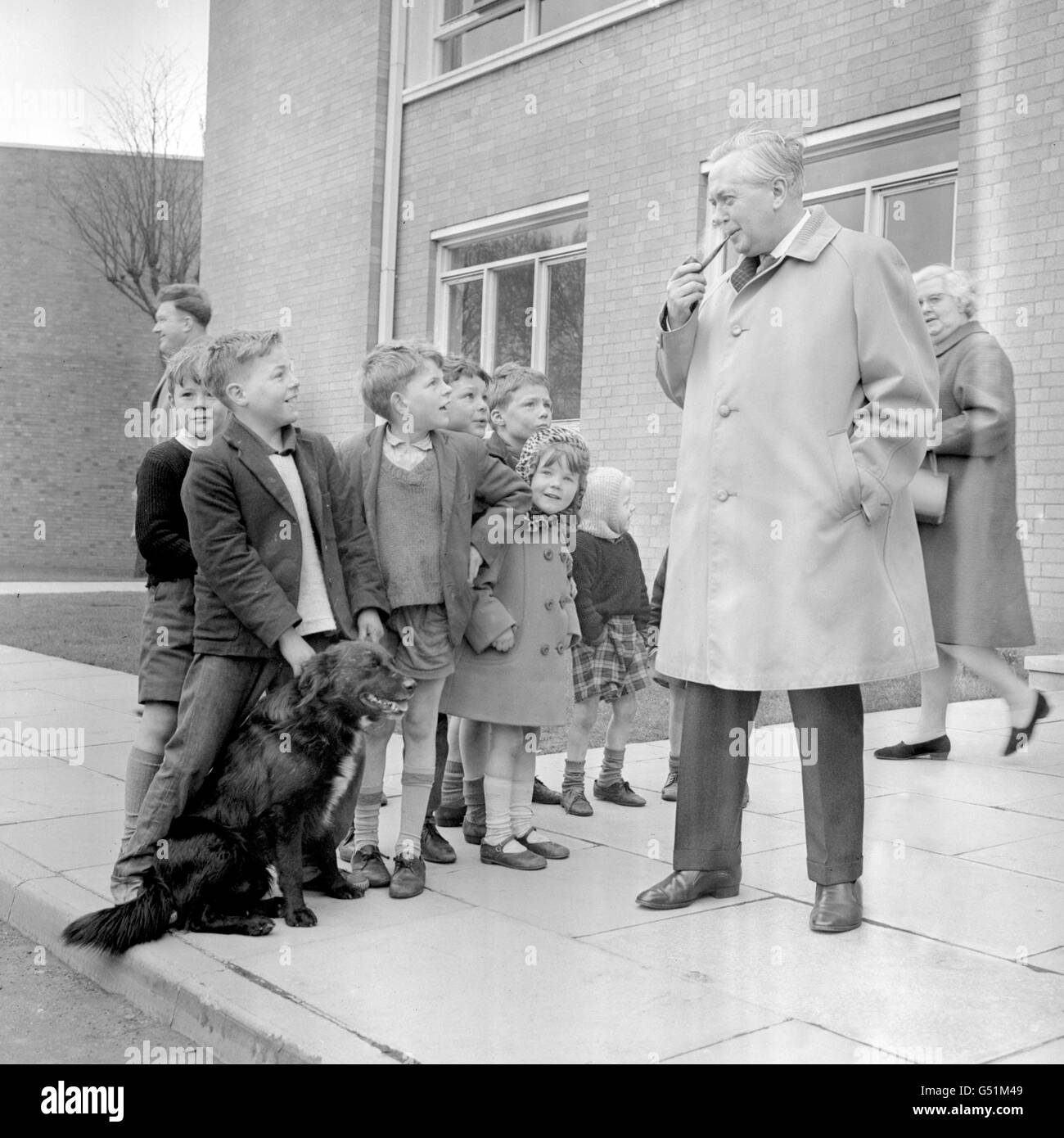 Prime Minister Harold Wilson chats to a group of children outside the ...