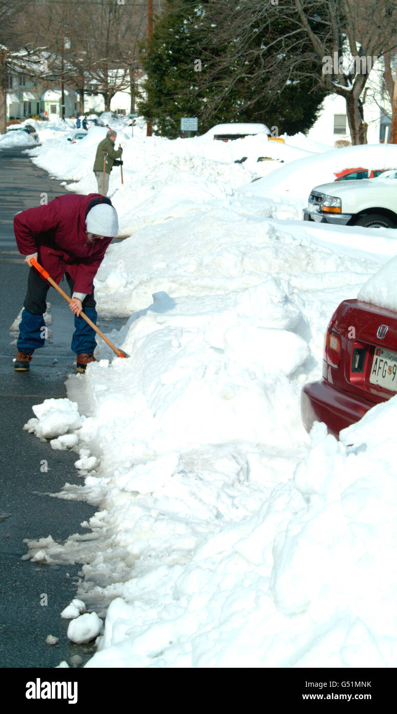 Woman snow car digging hi-res stock photography and images - Alamy