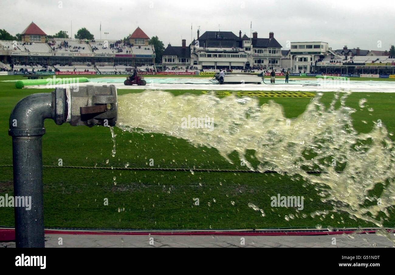 Rain water is pumped off the Trent Bridge pitch in Nottingham, as rain ...