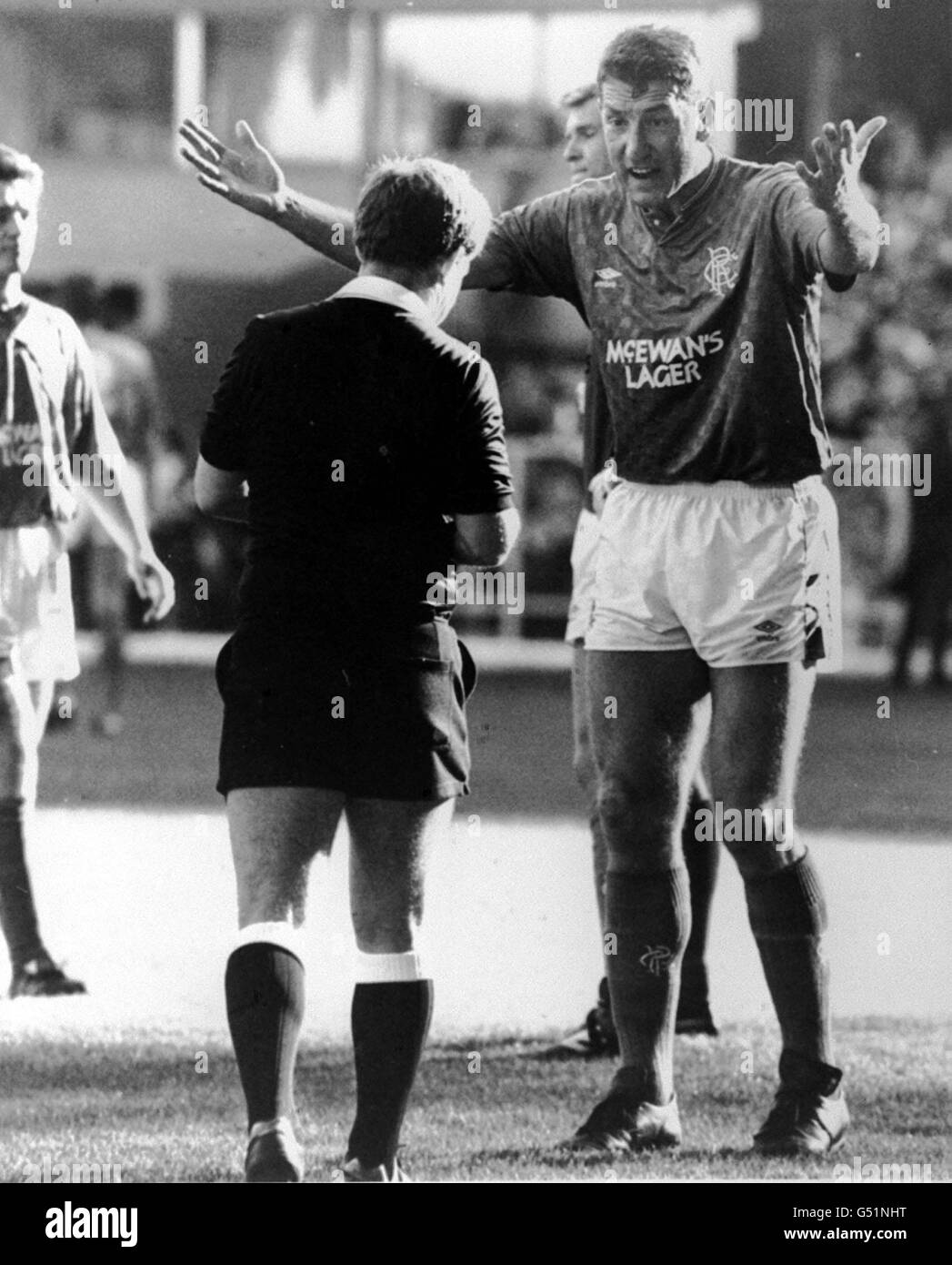 Rangers Terry Butcher protests to referee Jim Duncan about the sendings ...