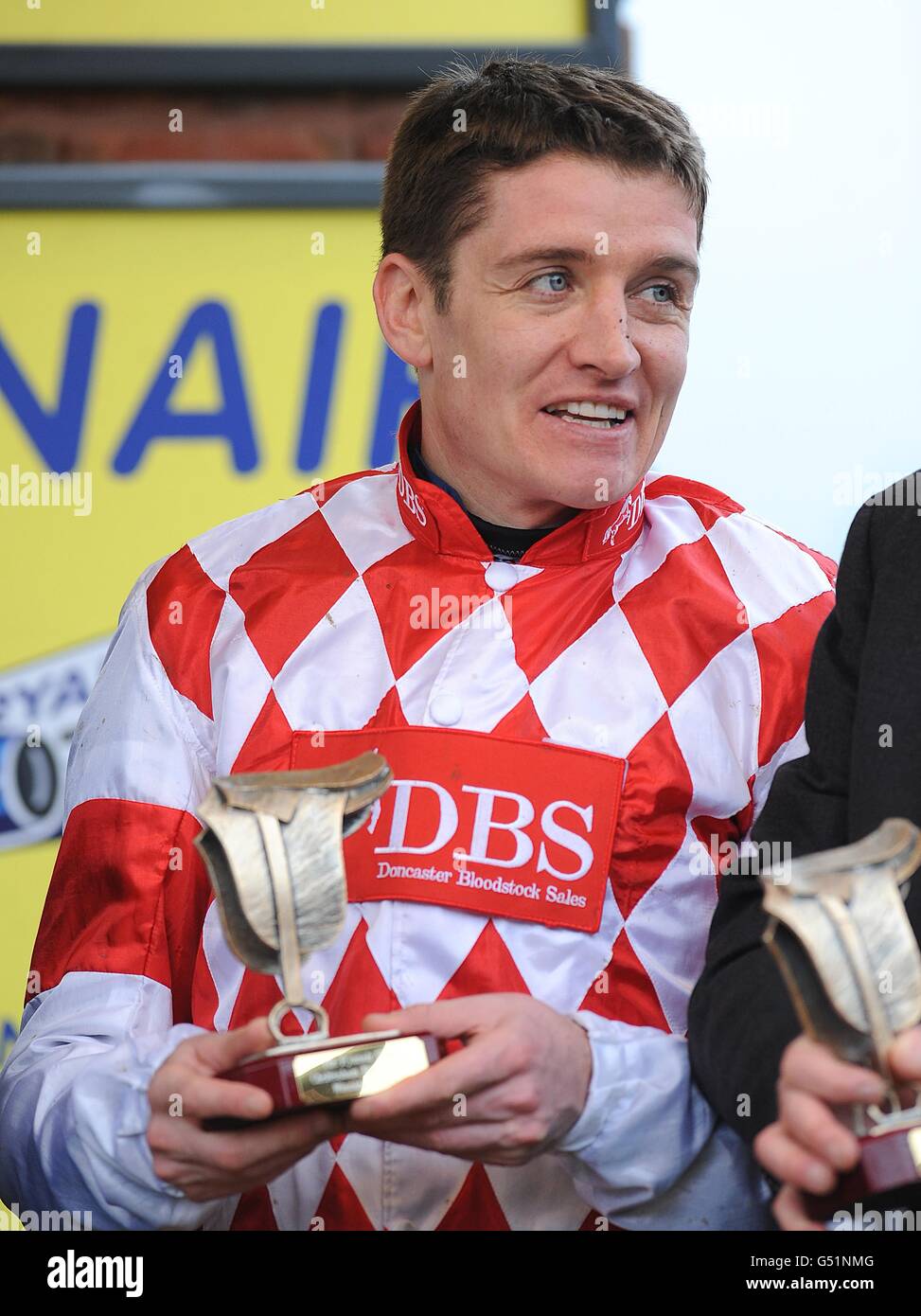 Jockey Barry Geraghty celebrates after winning the Ryanair Chase on ...