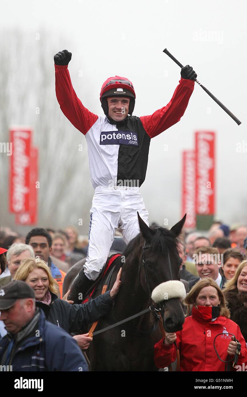 Jockey Ruby Walsh celebrates on Big Buck's after winning the Ladbrokes ...