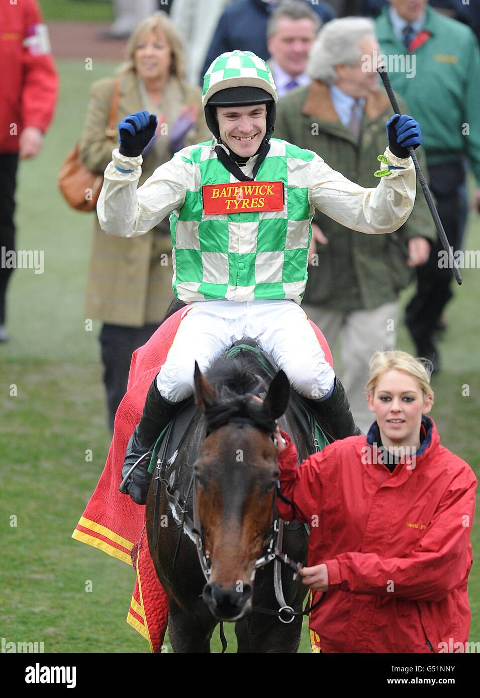 Jockey Tom Scudamore celebrates winning the Byrne Group Plate on Salut ...