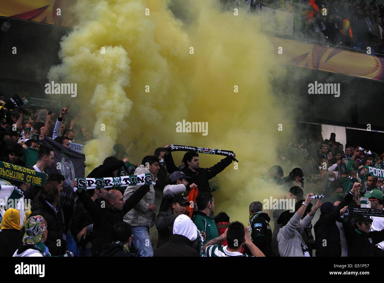 Sporting lisbon fans with flares in the stands hi-res stock photography ...