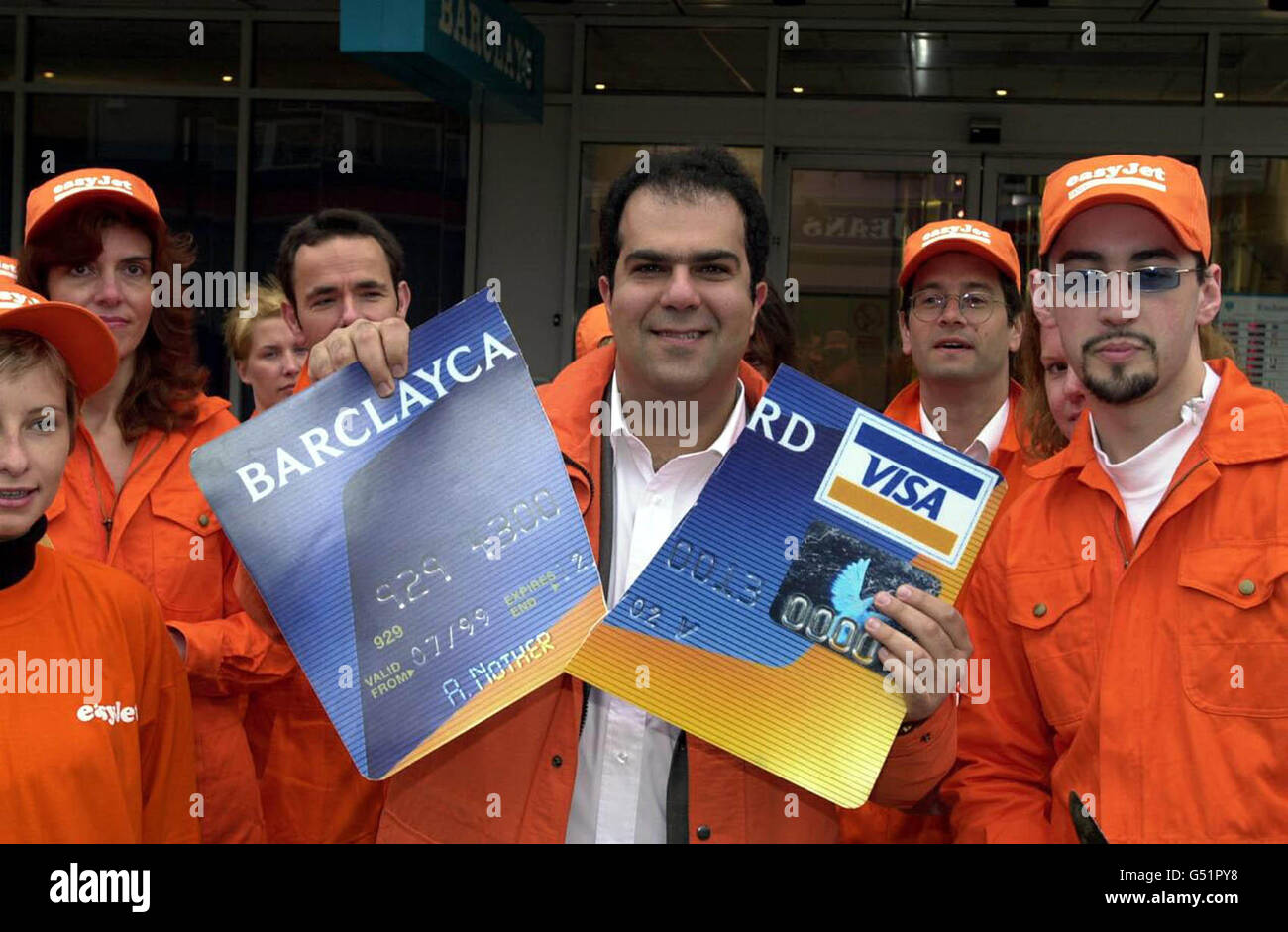 Employees stand with the chairman of easyjet hi-res stock photography ...