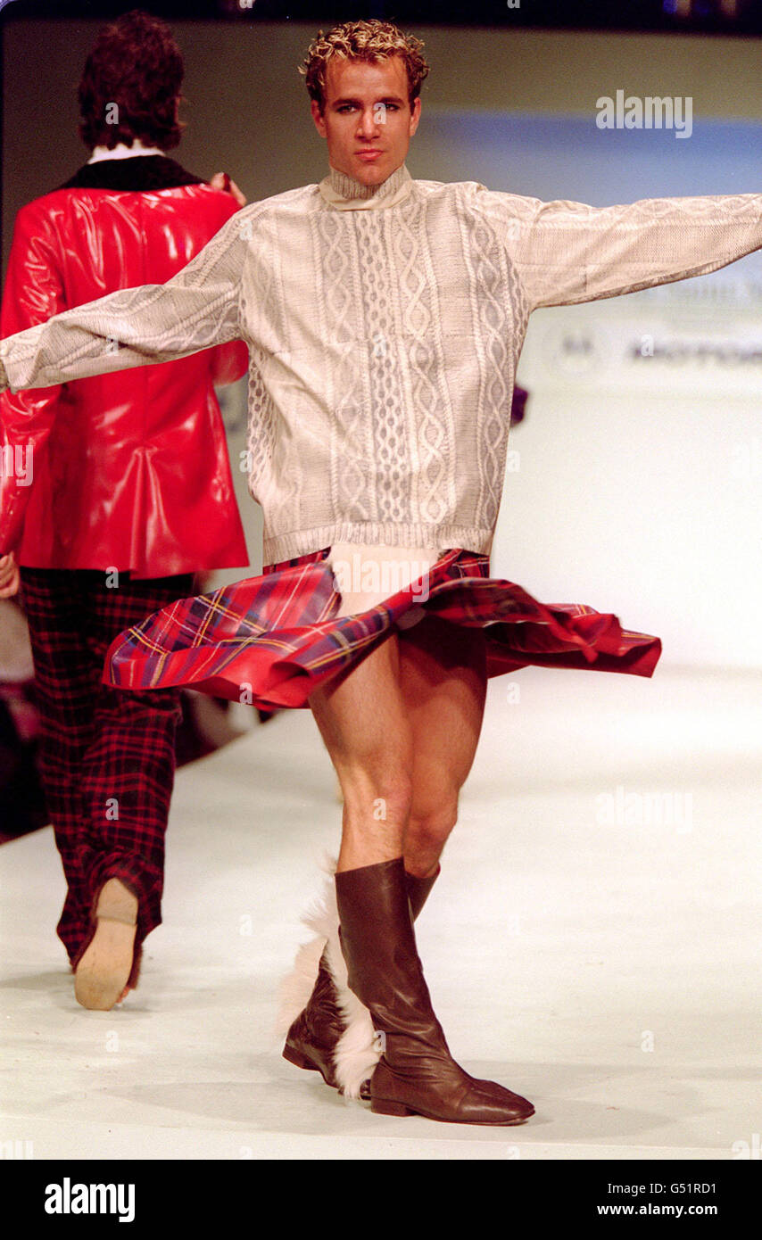 A model wearing an outfit from a graduate designer walks the catwalk ...