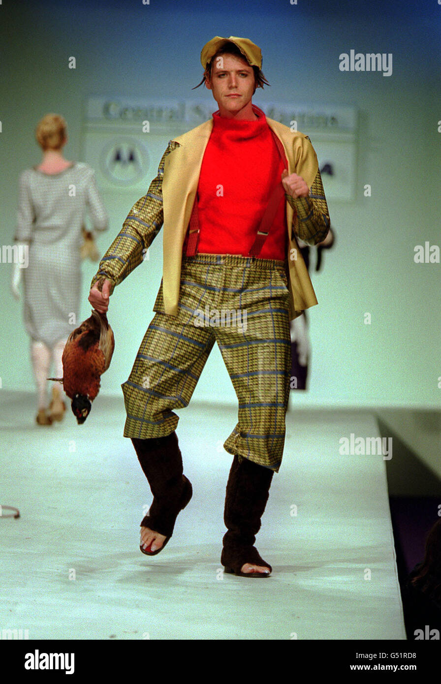 A model wearing an outfit from a graduate designer walks the catwalk ...