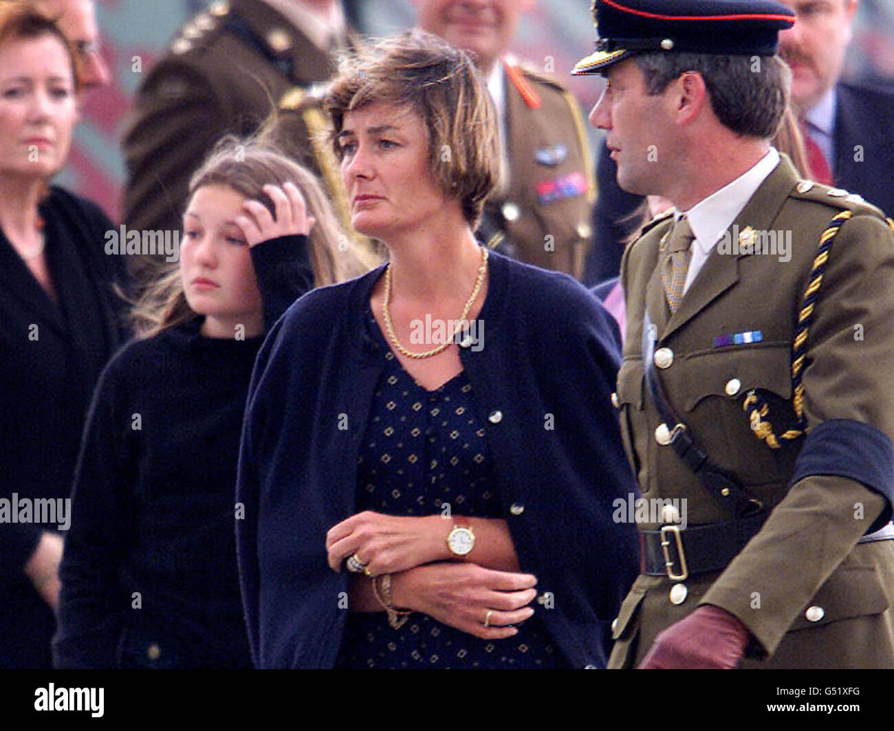 Heather Saunders (center) and her daughter Catherine (L) watch the ...