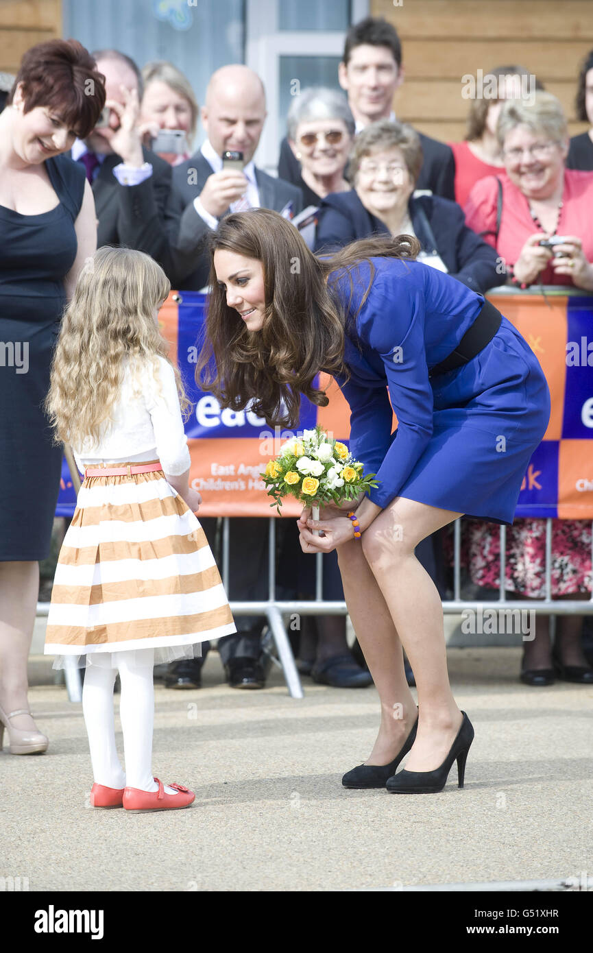 Duchess of Cambridge being presented with flowers by Tilly Jenning ...