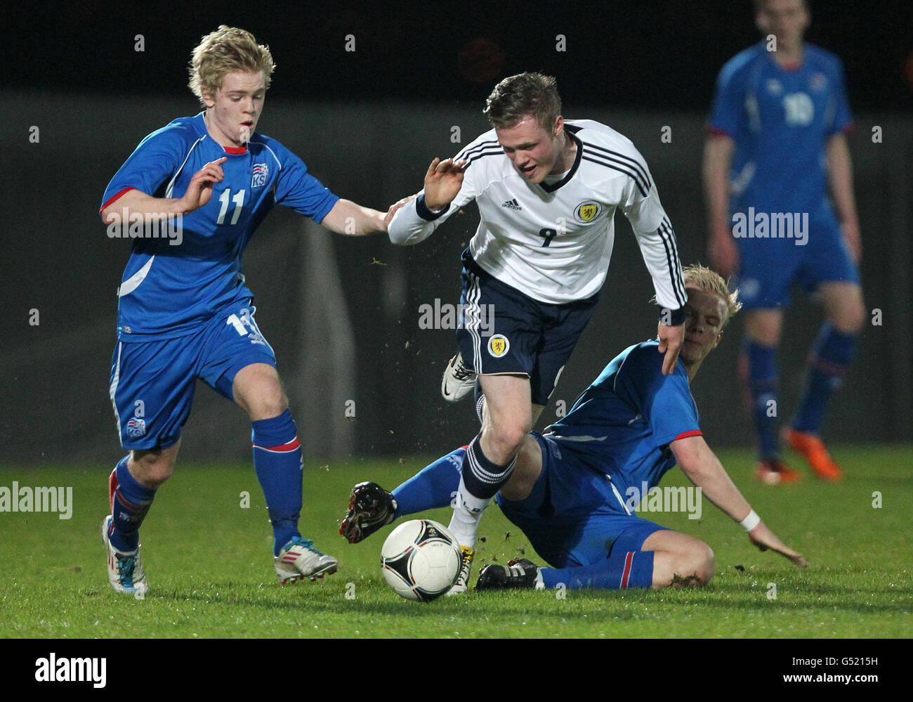 Scotland's Denny Lennon is challenged by Iceland's Daoi Bergsson and ...