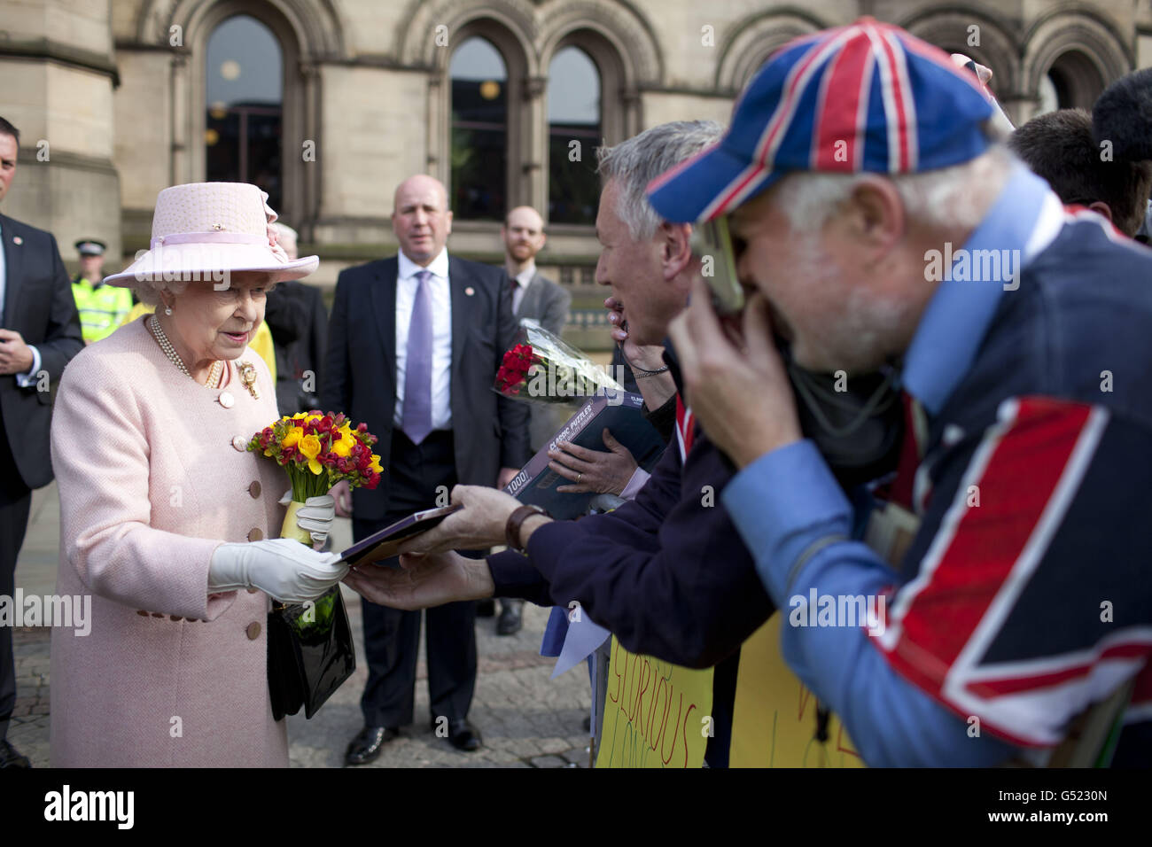 Queen Elizabeth II meeting people outside Manchester Town hall during ...