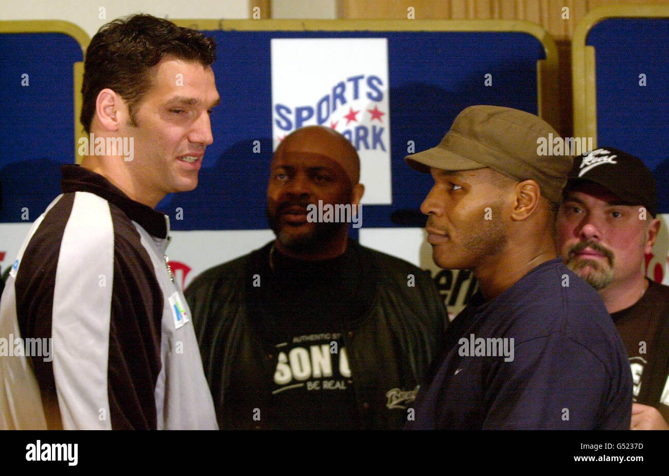 Heavyweight boxers Mike Tyson (r) and Lou Savarese come head to head ...