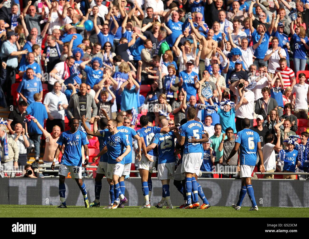 Chesterfield players celebrate after Swindon Town's Oliver Risser (not ...