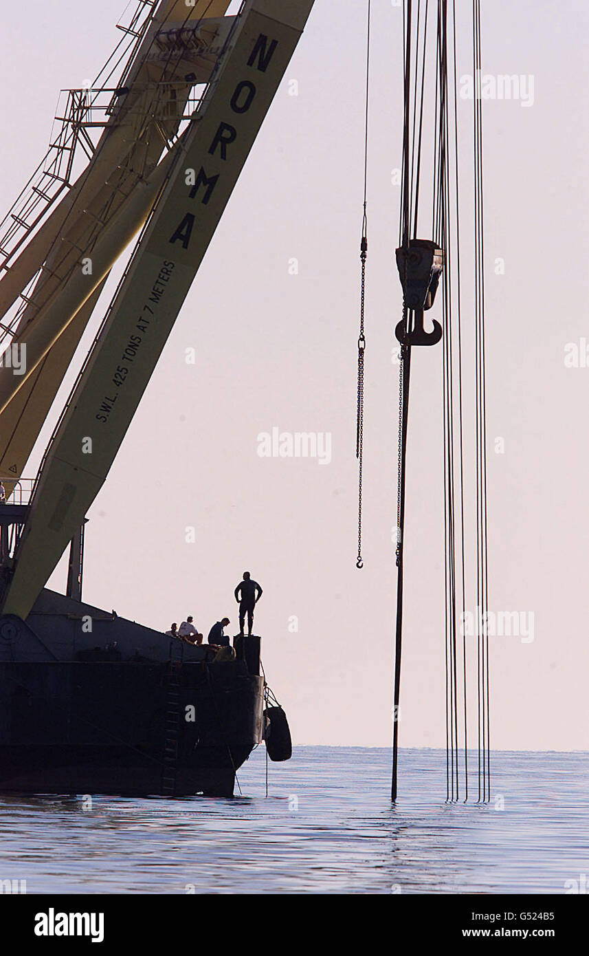 Salvage workers lift the trawler fishing vessel the solway harvester hi ...