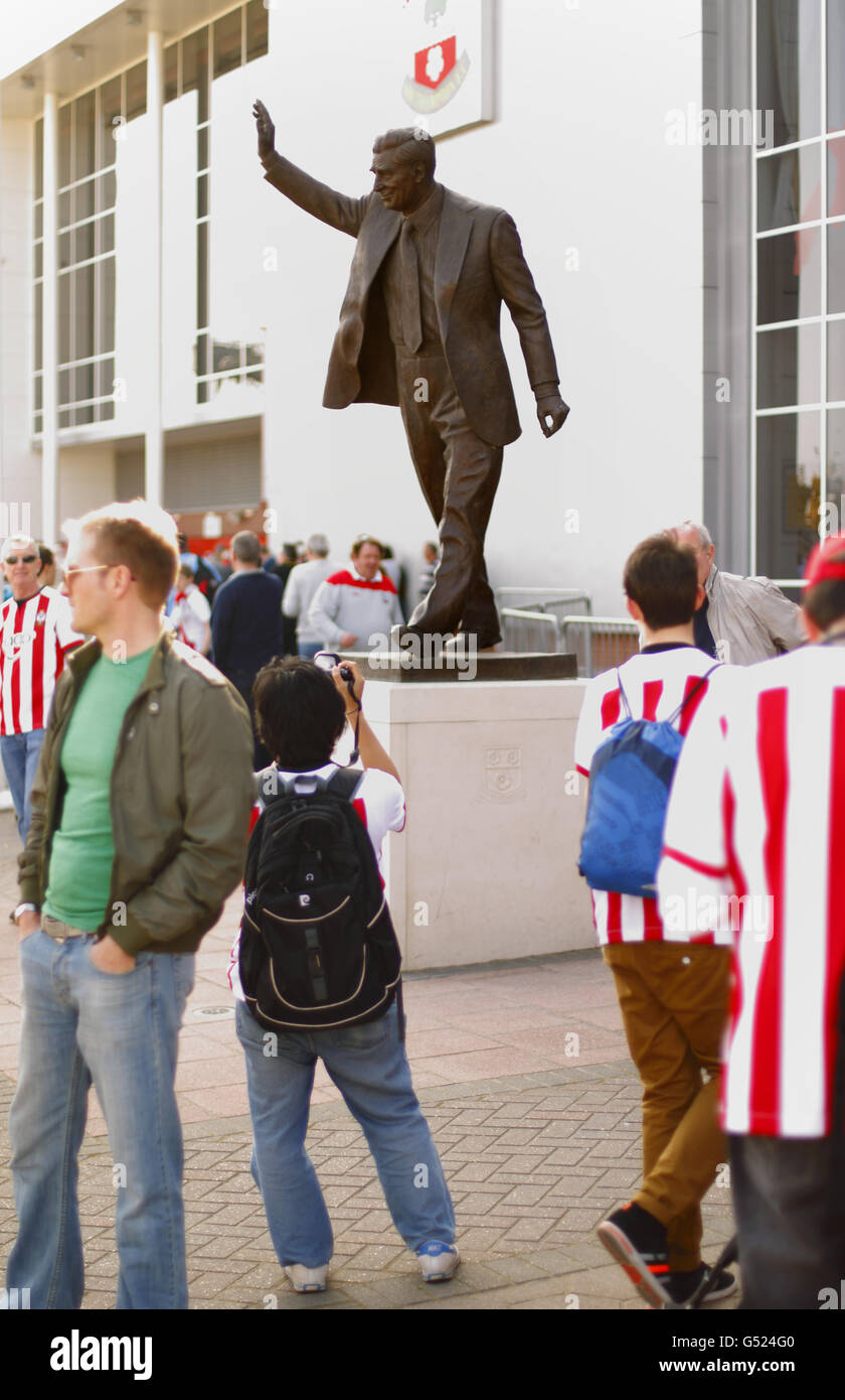 A statue of former Southampton player and manager Ted Bates towers over ...