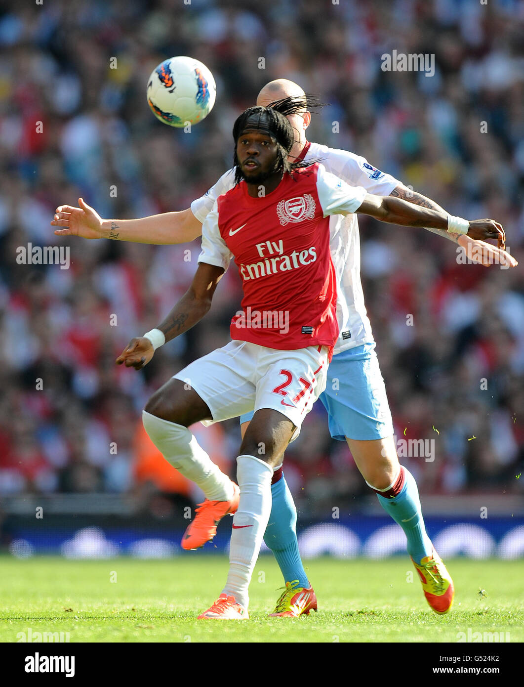 Arsenal's Gervinho (front) and Aston Villa's Alan Hutton battle for the ...