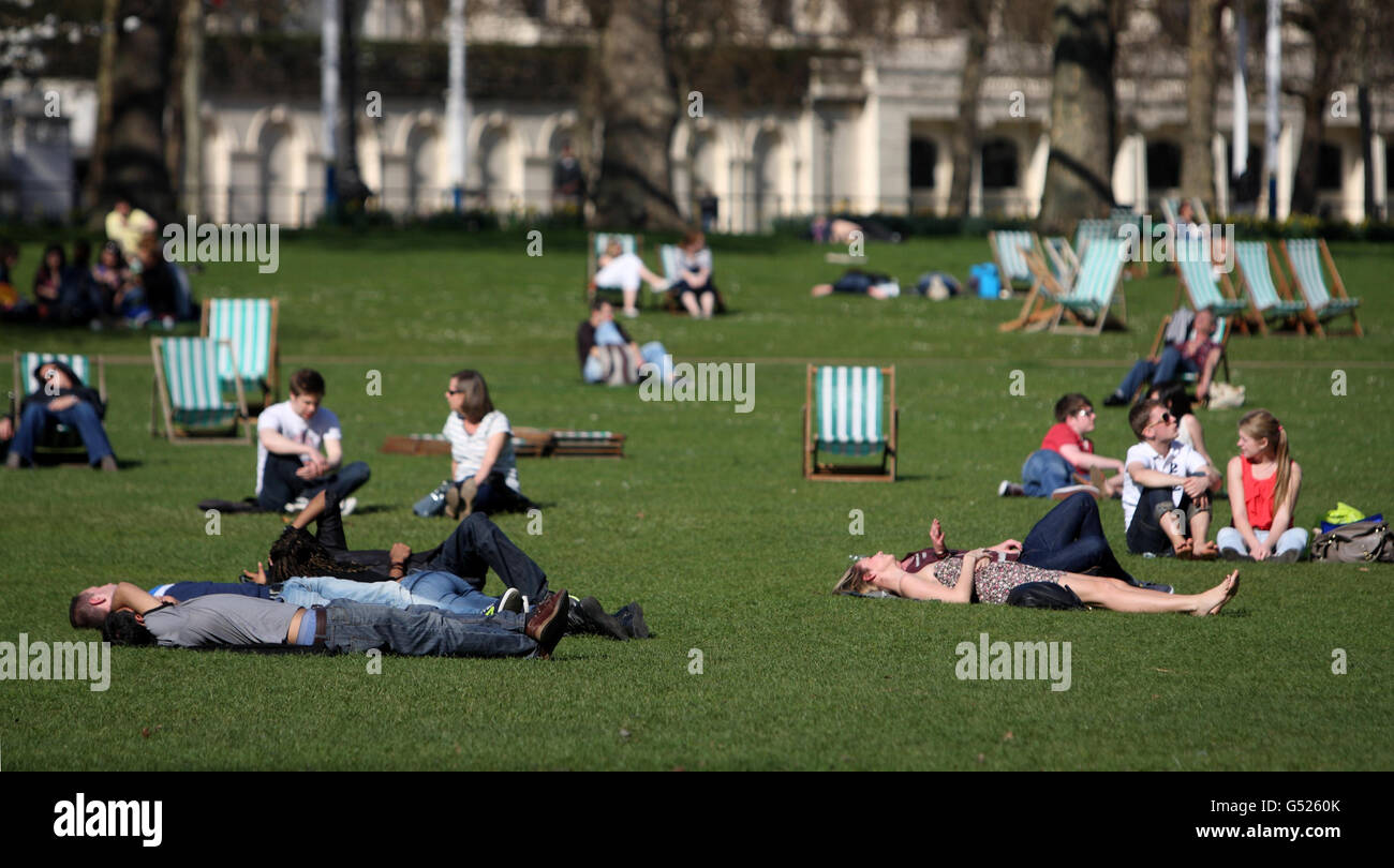 Sun bathers in St James's Park in central London, as the recent good ...