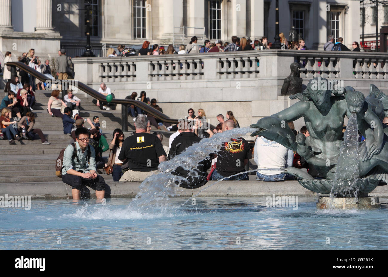 Sun bathers in Trafalgar Square in central London, as the recent good ...