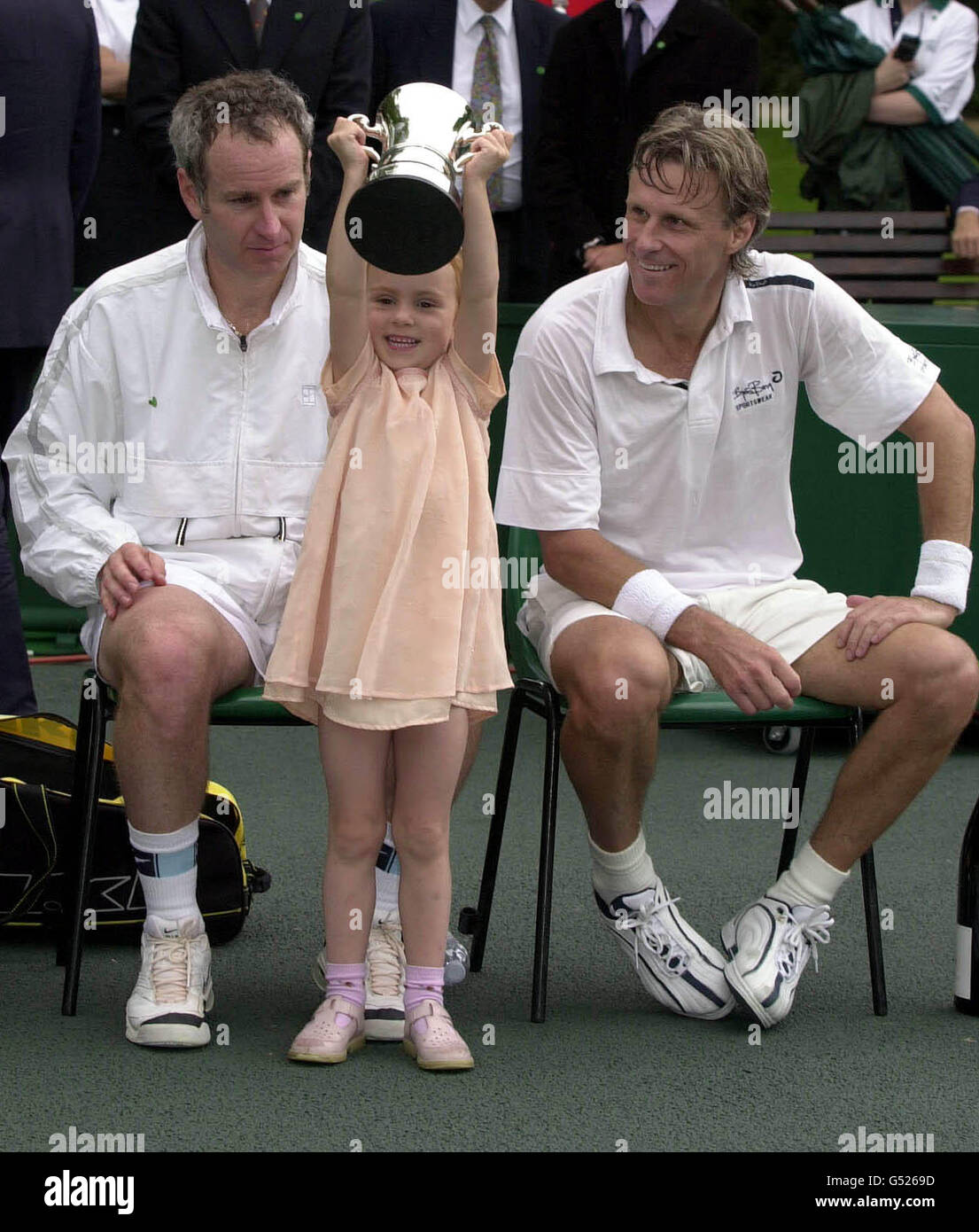 John McEnroe's daughter, four year old Anna McEnroe, holds her father's ...