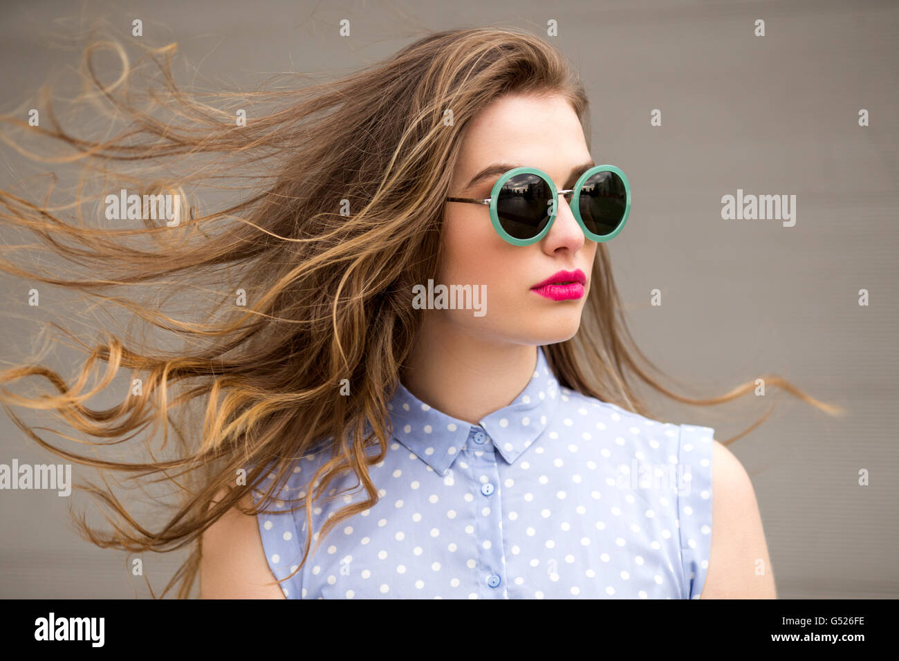 Stylish woman in the wind hi-res stock photography and images - Alamy