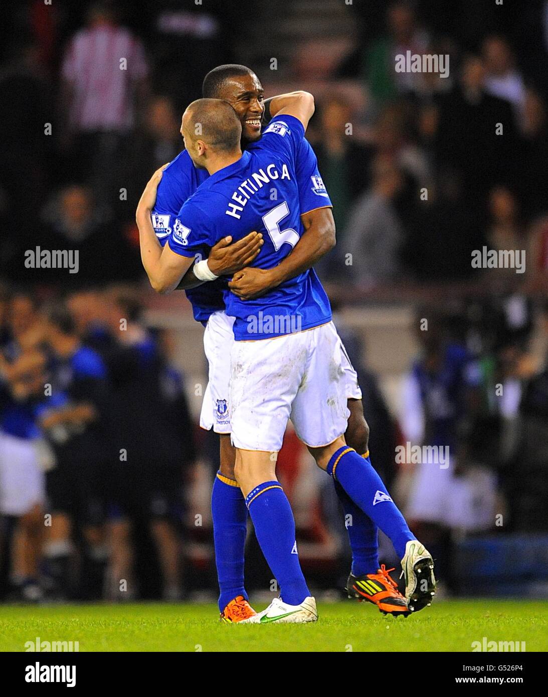 Everton's Johnny Heitinga (5) and Sylvain Distin celebrate after the ...