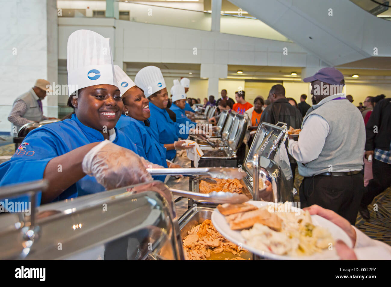 Detroit, Michigan - Workers serve dinner during a convention of the ...