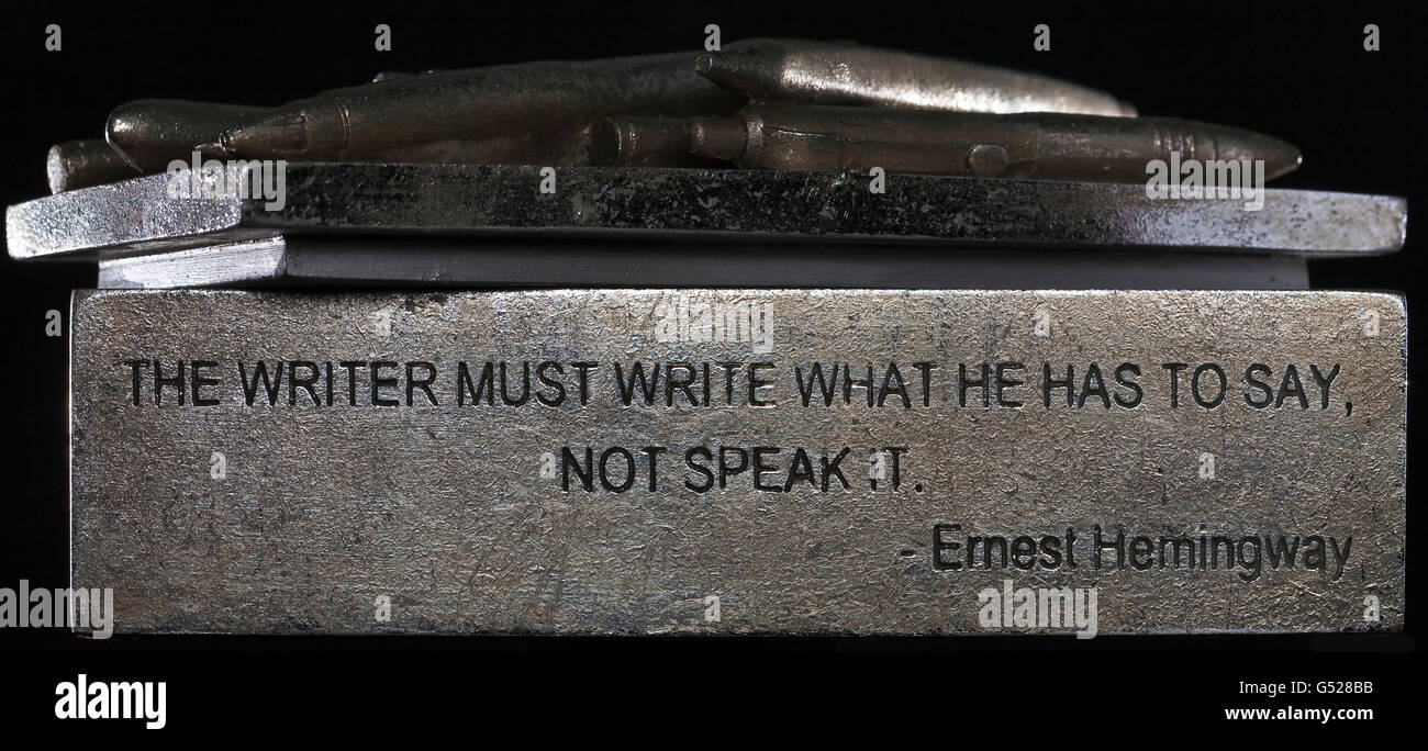 Metal pen and pencil box with hemingway quote Stock Photo - Alamy
