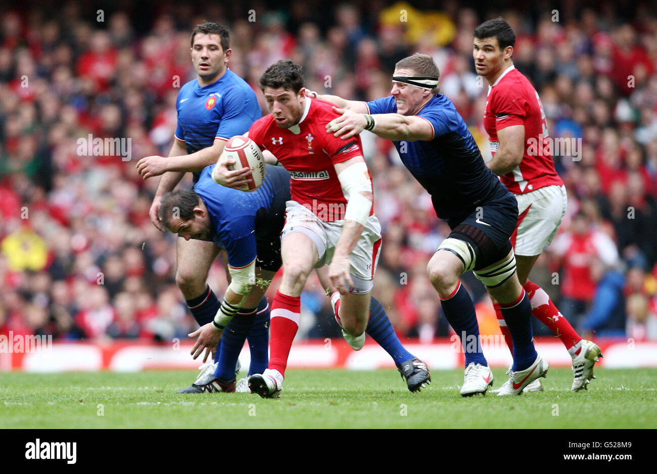 Wales' Alex Cuthbert breaks away from France's Imanol Harinordoquy ...