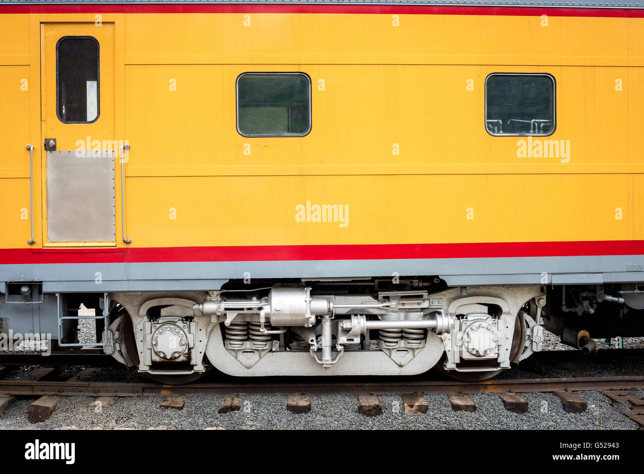 Yellow train car with window and door Stock Photo - Alamy