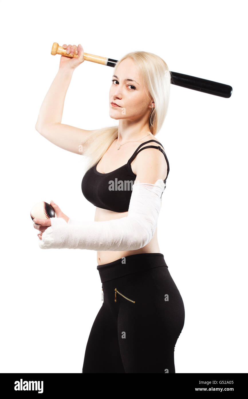 Blond girl with a broken arm in plaster, holding baseball bat and ball ...