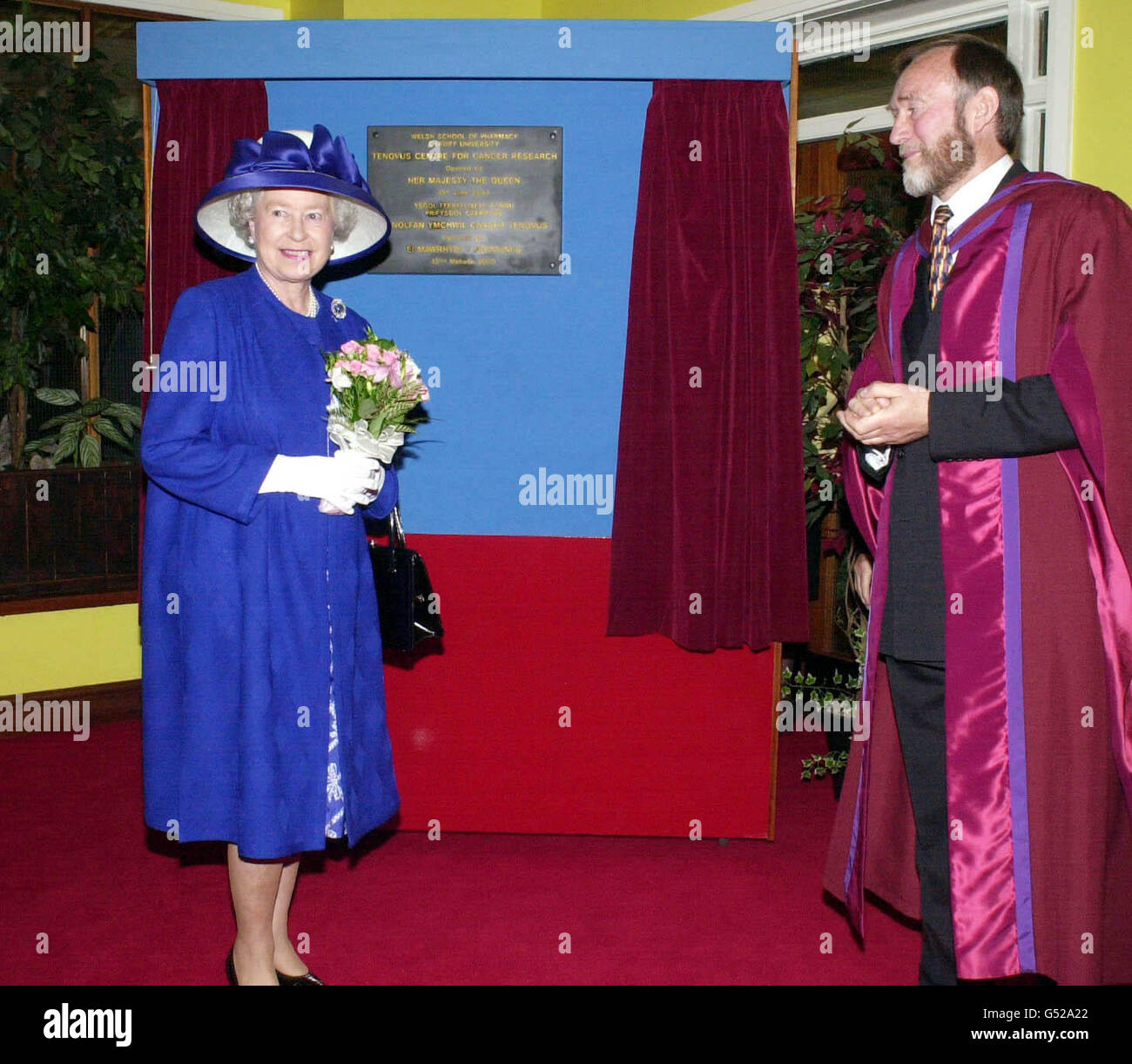 Queen Elizabeth II unveils a plaque to open the new Tenovus ...