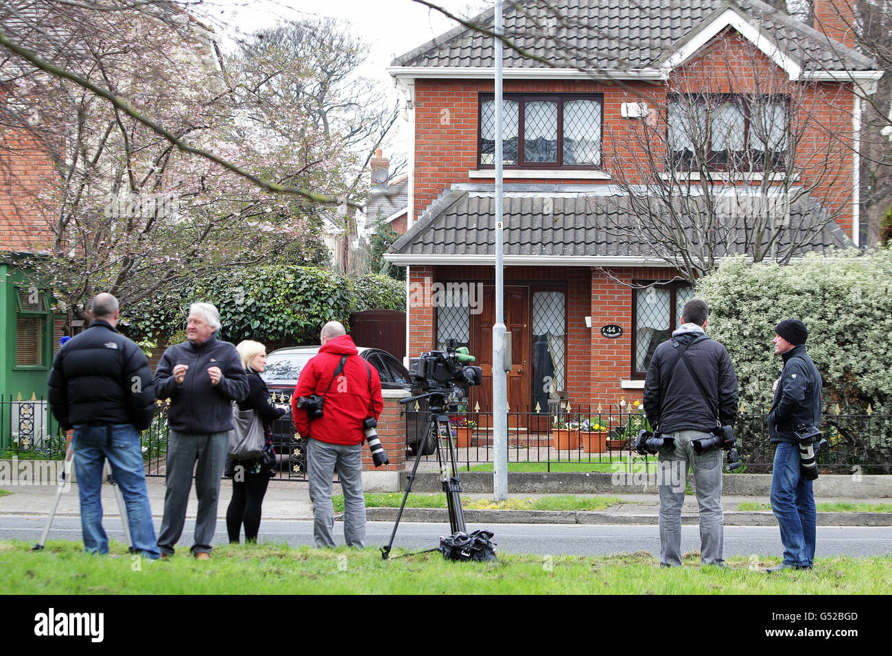 Members of the media wait outside former Taoiseach Bertie Ahern's house ...
